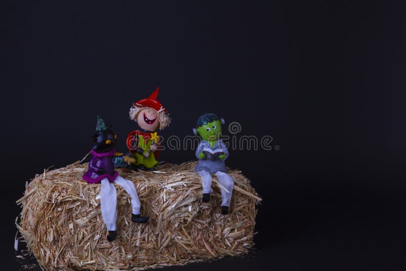 Halloween Characters Sitting on a Haystack - Fun Times Stock Image ...