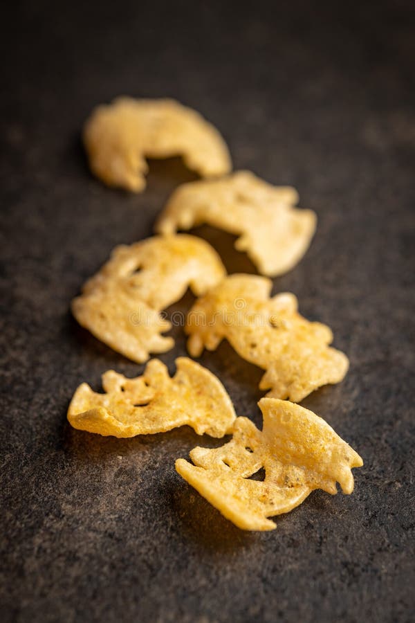 Halloween Crispy Bat Shaped Chips on Dark Table Stock Image - Image of ...
