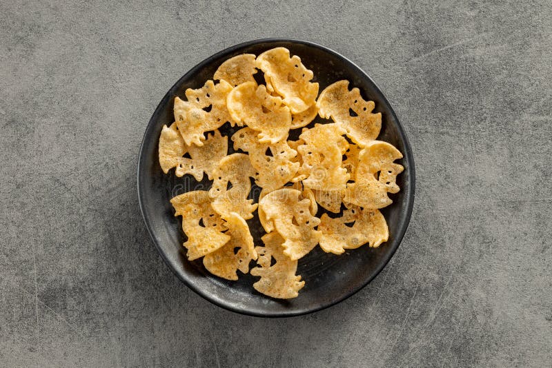 Halloween Crispy Bat Shaped Chips on Plate. Top View Stock Photo ...