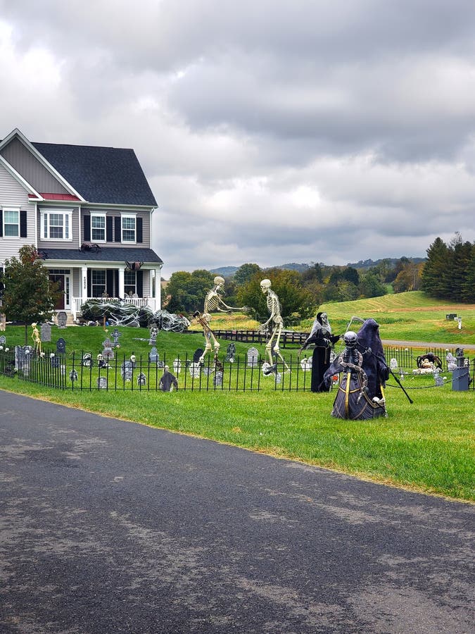 Halloween Decorations on the Lawn in Front of the House. Skeletons and ... Halloween Decorations on the Lawn in Front of the House. Skeletons and ...