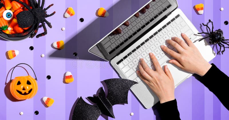 Halloween Decorations with Person Using a Laptop Computer Stock Photo ...