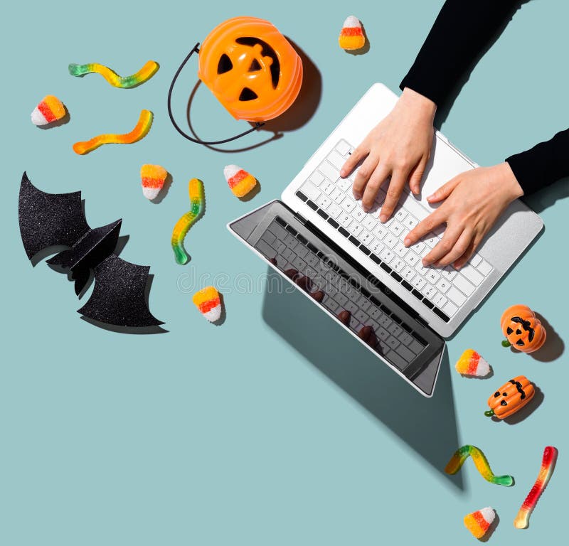 Halloween Decorations with Person Using a Laptop Computer Stock Photo ...