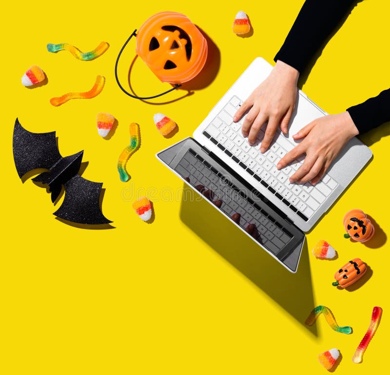 Halloween Decorations with Person Using a Laptop Computer Stock Photo ...