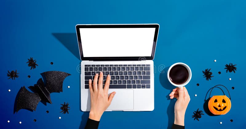 Halloween Decorations with Person Using a Laptop Computer Stock Photo ...
