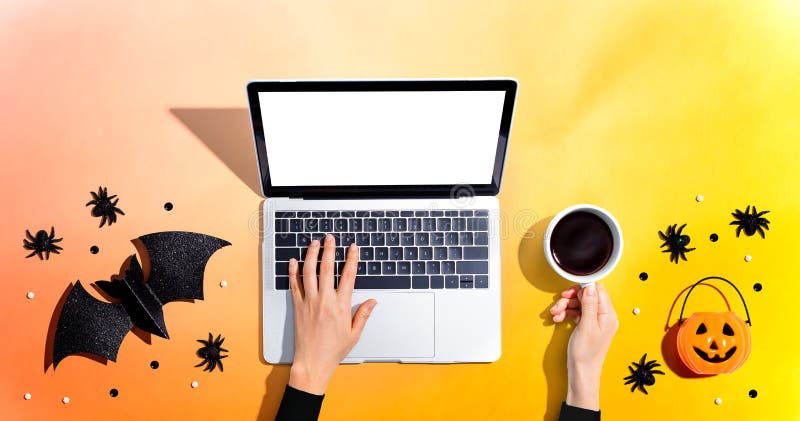Halloween Decorations with Person Using a Laptop Computer Stock Photo ...