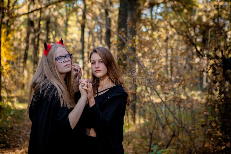 Halloween Demon and Witch in the Woods Stock Photo - Image of clothing ...