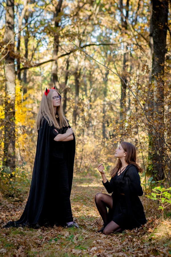 Halloween Demon and Witch in the Woods Stock Image - Image of cloak ...