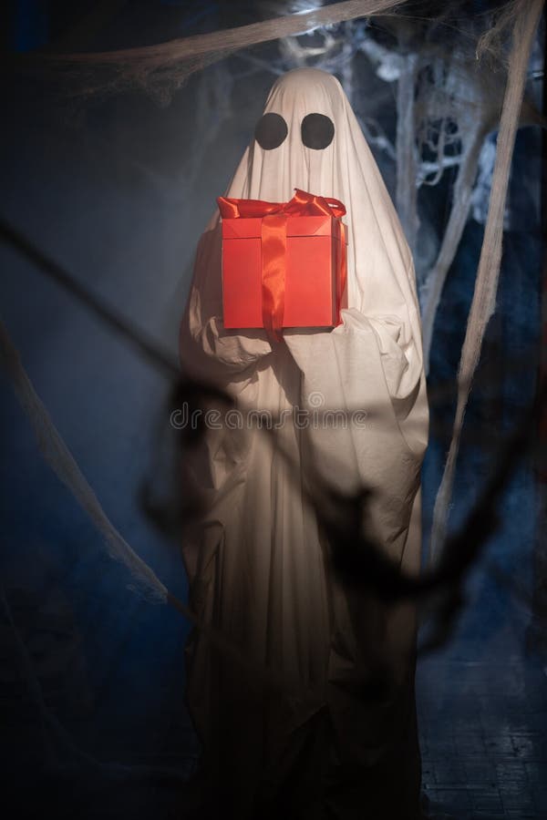 Halloween Ghost Holding Gift Box Positive Happy Expression in Darkness ...