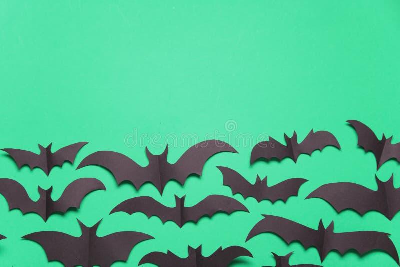 Halloween Paper Vampire Bat Decorations on a Green Background Stock ...