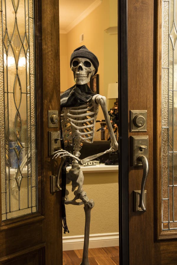 Halloween Skeleton Greeting at the Door Stock Photo - Image of drape ...