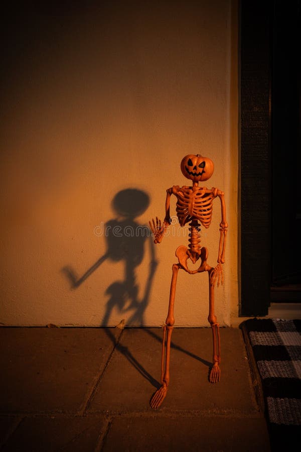 Halloween Skeleton with Pumpkin Head Casting Shadow. Stock Image ...