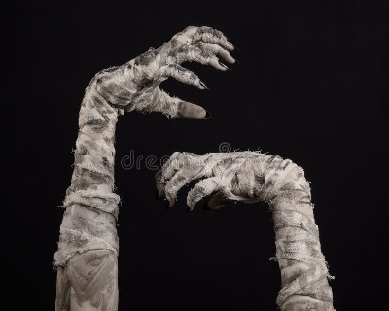 Halloween Theme: Terrible Old Mummy Hands On A Black Background Stock ...