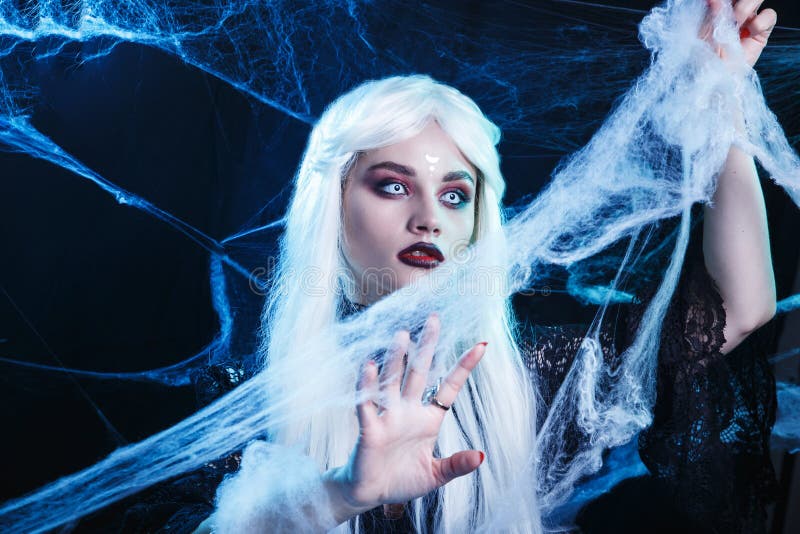 Halloween Witch with Long White Hair Wearing Spider Web. Stock Photo ...