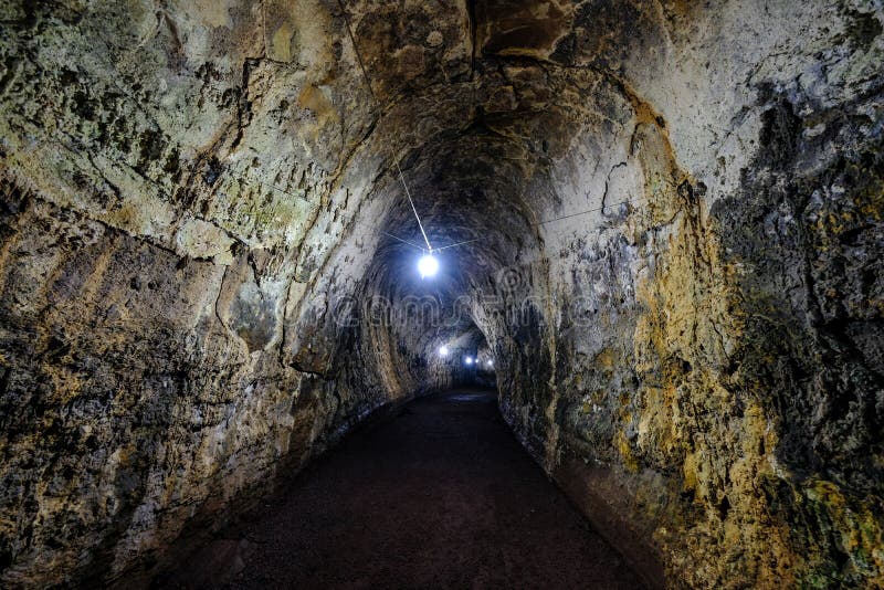 Hallway in a Cave with Lights Hanging from the Ceiling Stock Image ...