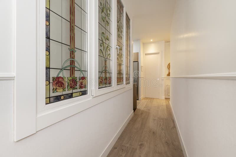 Hallway in an Empty House with Decorative Windows and Wooden ...