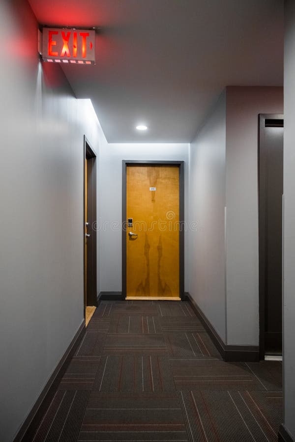 Hallway with exit sign stock image. Image of color, apartment - 115289085
