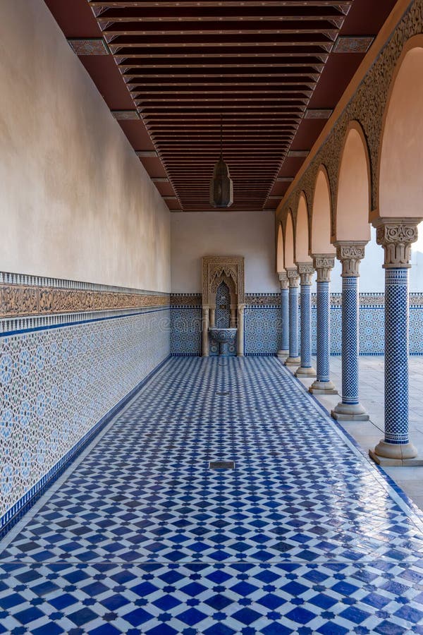 A Long Hallway with Blue Tiles and a Blue and White Wall Stock Photo ...