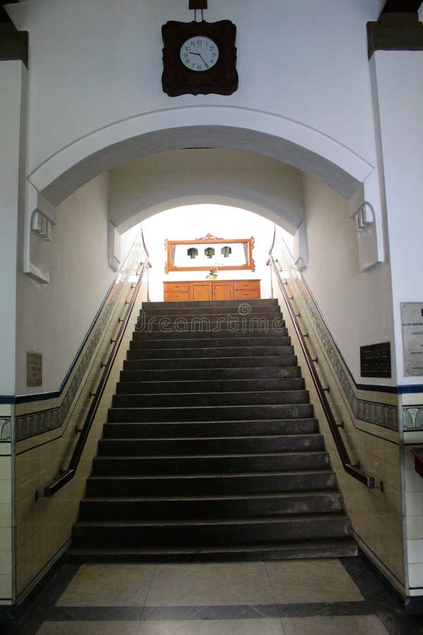 A Hallway with Stairs and a Door To a Kitchen Stock Image - Image of ...