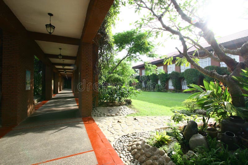 Hallway of a Structure in the Philippines with an Open Courtyard beside ...