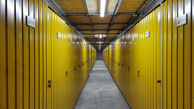 Hallway with Yellow Storage Units. Concrete Floor. Stock Image - Image ...