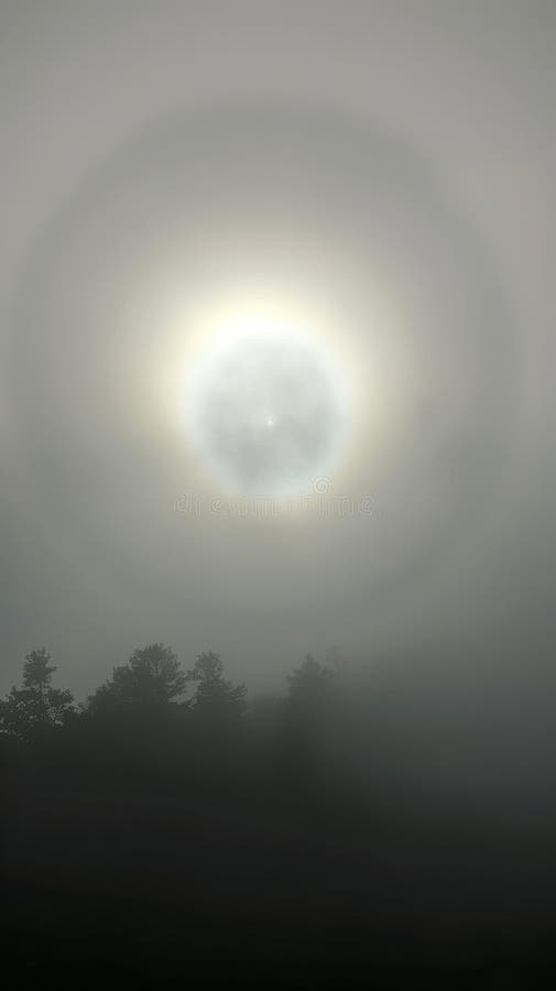 Halo Phenomenon Around the Sun in a Misty Sky Stock Image - Image of ...