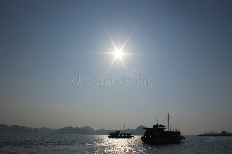 Halong Bay Cruise Vietnam with Sun Overhead Stock Image - Image of ...