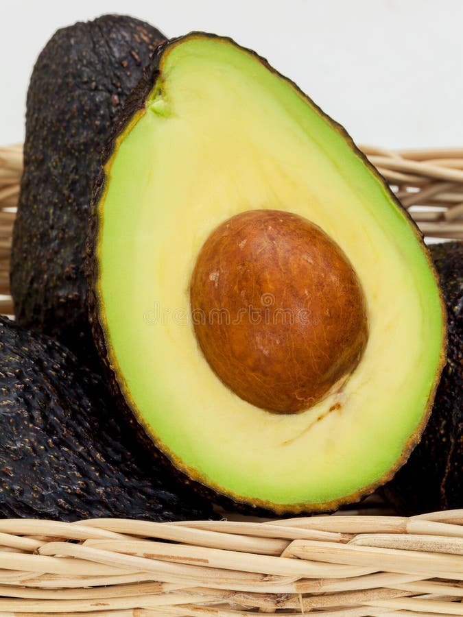 Halved avocado with core - stock photo. Image of nutrition - 55536836