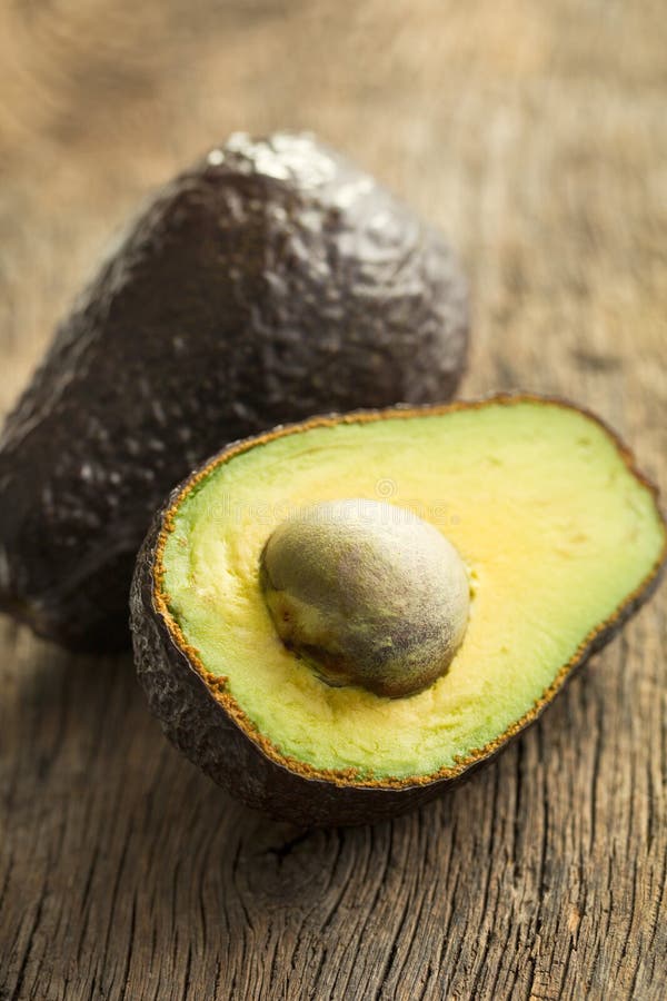 Halved Avocado on Old Table Stock Image - Image of nutrition, healthy ...