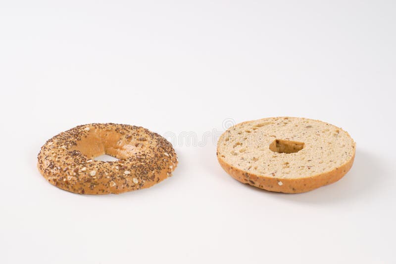 Halved bagel with seeds stock photo. Image of white, wheat - 76567208