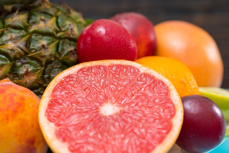 Halved Fresh Ruby Grapefruit with Tropical Fruit Stock Photo - Image of ...