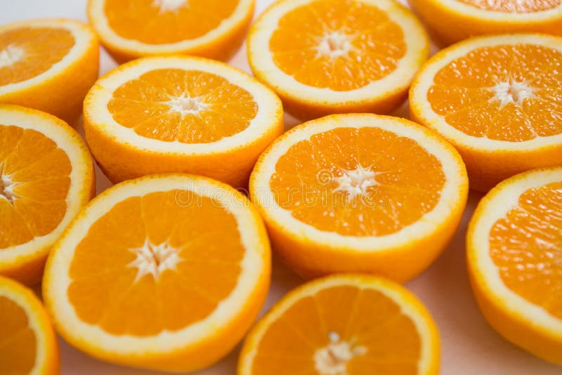 Halved Oranges on White Background Stock Photo - Image of shiny, orange ...