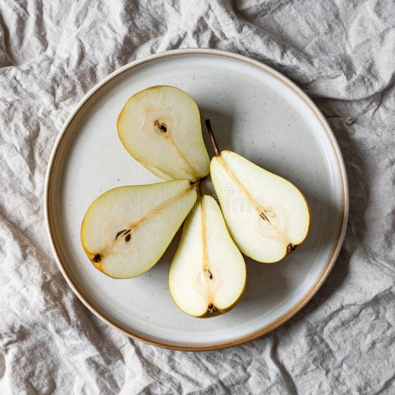 Halved Pears on a Ceramic Plate with Rustic Linen Backdrop Still Life ...