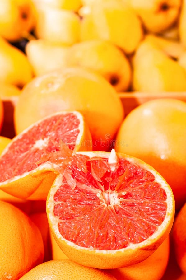 Halved Pink Grapefruit, on Pile of Whole Grapefruits Stock Photo ...