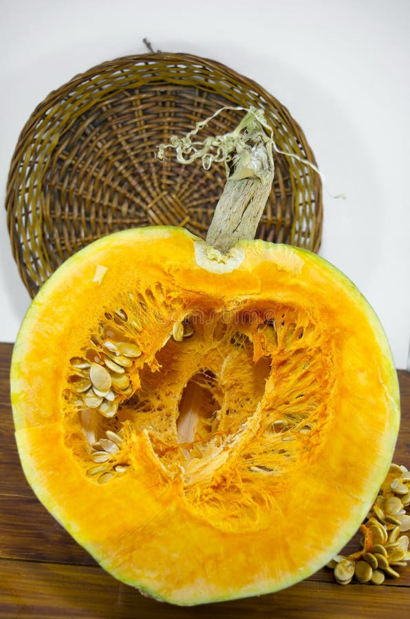 Halved Pumpkin Against a Wooden Surface Stock Photo - Image of fall ...