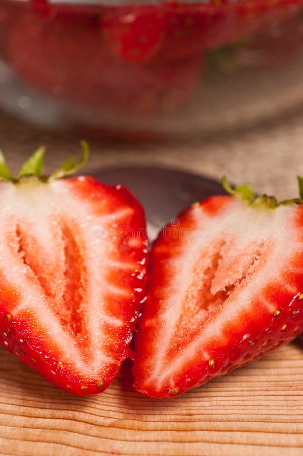 Halved Strawberry on Cutting Bosrf Stock Photo - Image of wood, grain ...