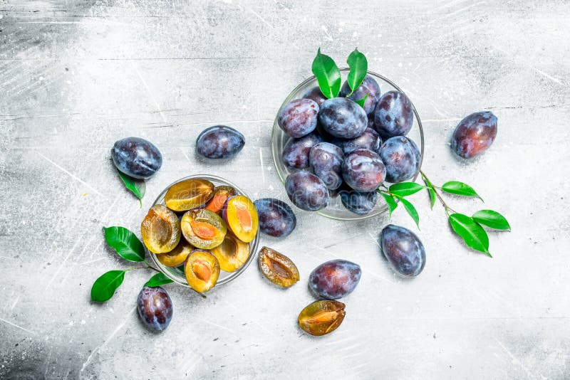 Halves of Fragrant Plum in a Glass Bowl Stock Photo - Image of berry ...