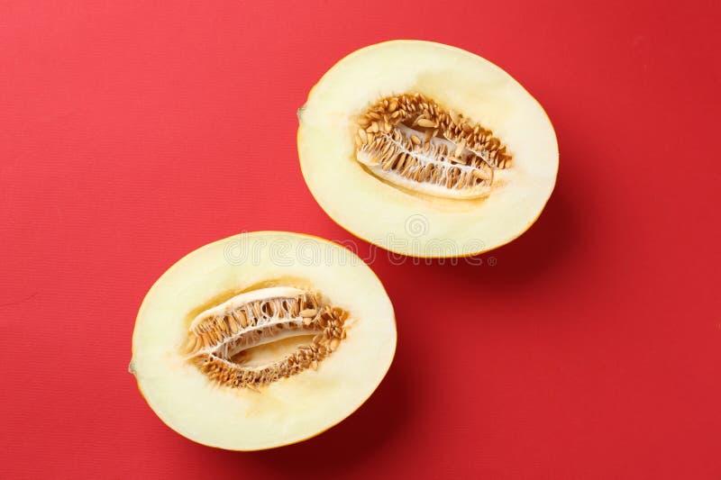 Halves of Fresh Melon on Red Background, Top View Stock Photo - Image ...