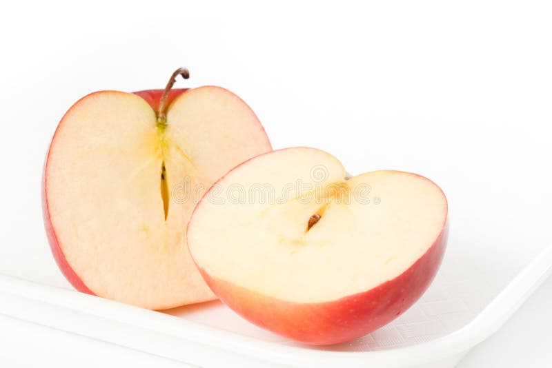 Halves of fresh red apple stock photo. Image of orange - 278183946