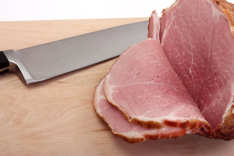 Ham on a board with knife stock photo. Image of food - 13847024
