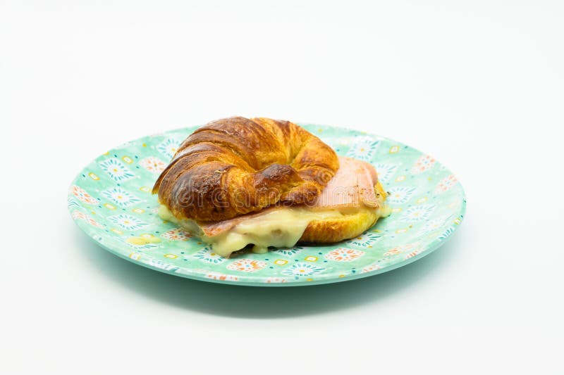 A Ham and Cheese Croissant on a Blue Plate Stock Image - Image of ...