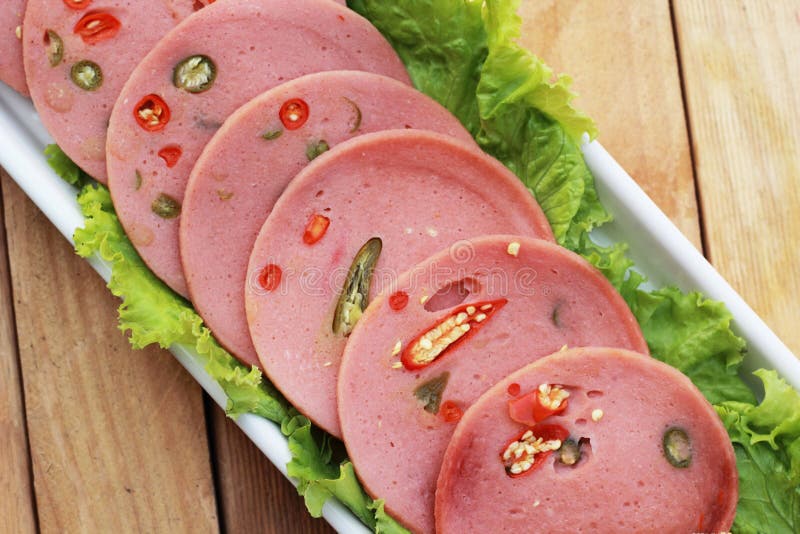 Ham Cut into Circular Discs with Red Peppers and Egg Fried. Stock Image ...