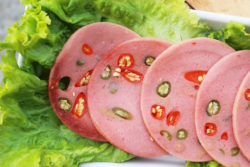 Ham Cut into Circular Discs with Red Peppers and Egg Fried. Stock Image ...