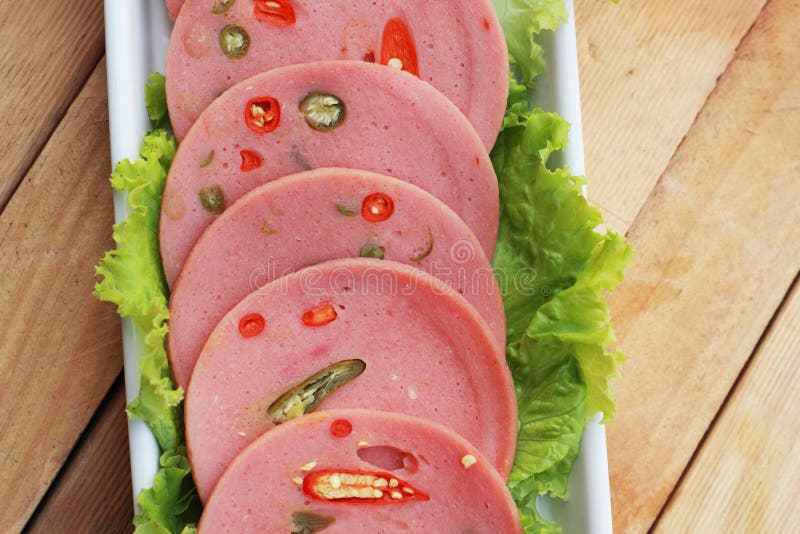 Ham Cut into Circular Discs with Red Peppers and Egg Fried. Stock Image ...