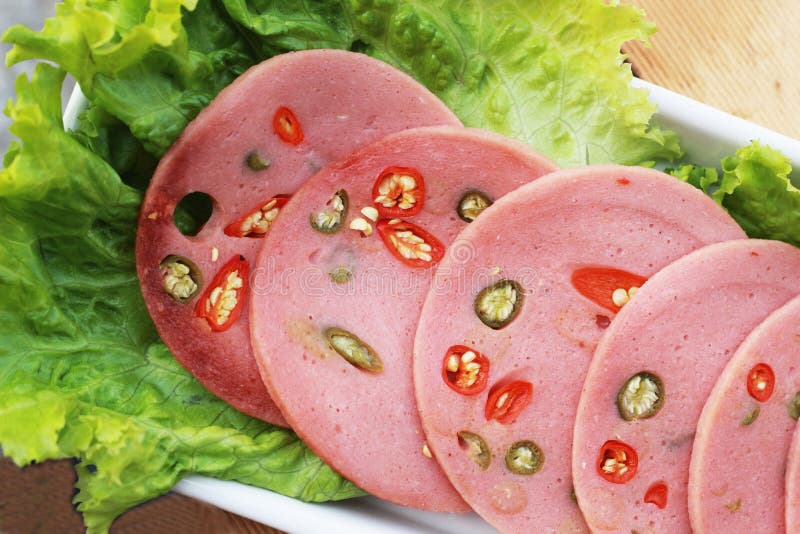 Ham Cut into Circular Discs with Red Peppers and Egg Fried. Stock Image ...