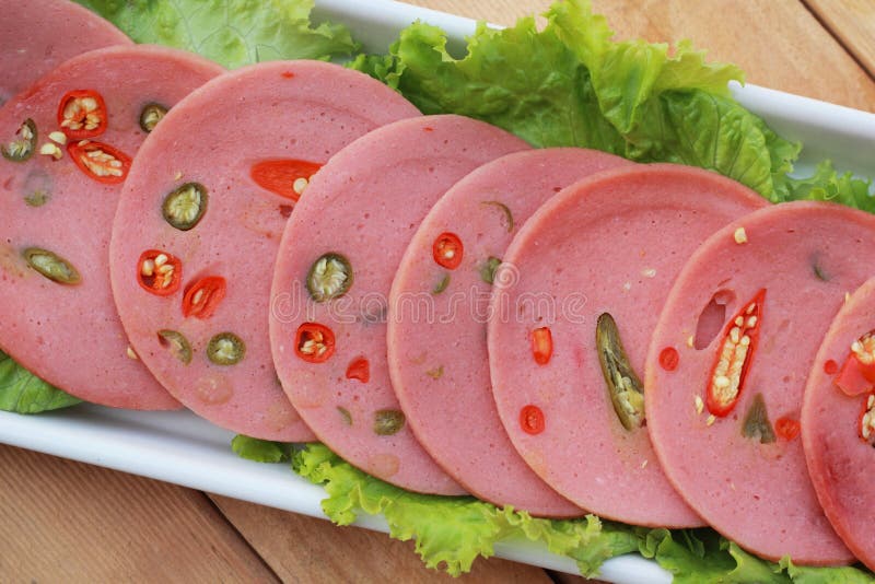 Ham Cut into Circular Discs with Red Peppers and Egg Fried. Stock Image ...