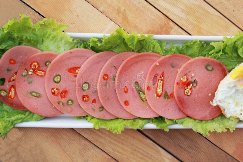 Ham Cut into Circular Discs with Red Peppers. Stock Image - Image of ...