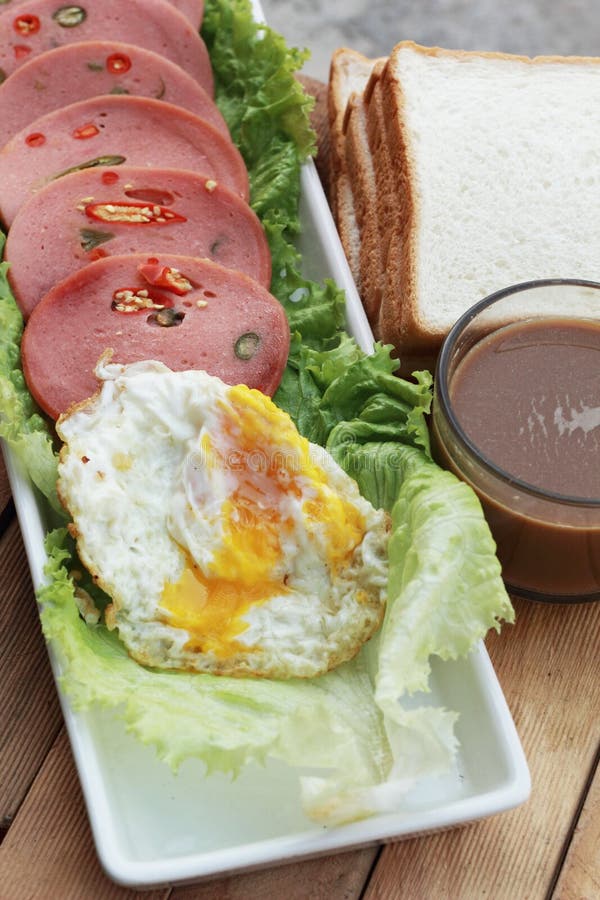 Ham Cut into Circular Discs with Red Peppers and Hot Coffee Stock Photo ...