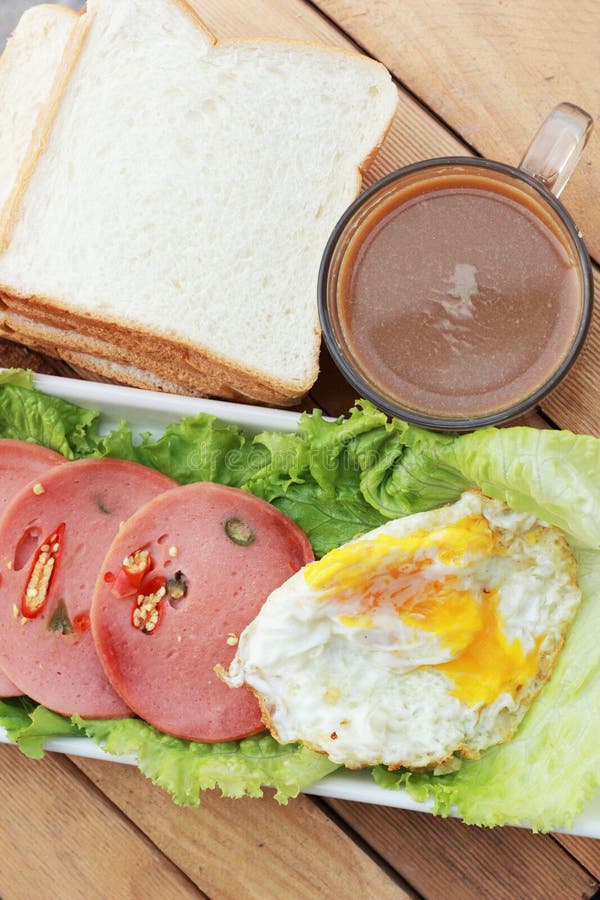 Ham Cut into Circular Discs with Red Peppers and Egg Fried. Stock Image ...