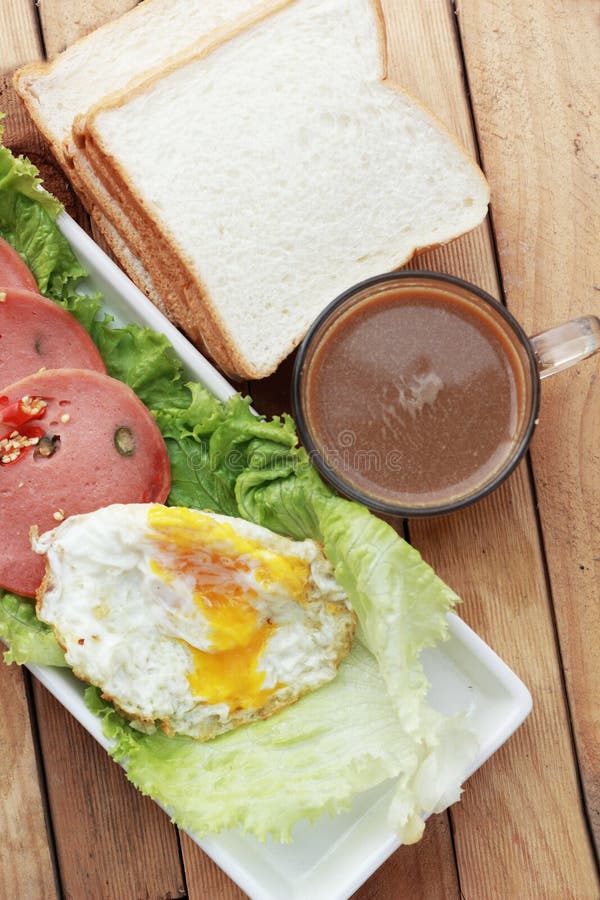 Ham Cut into Circular Discs with Red Peppers and Hot Coffee Stock Image ...