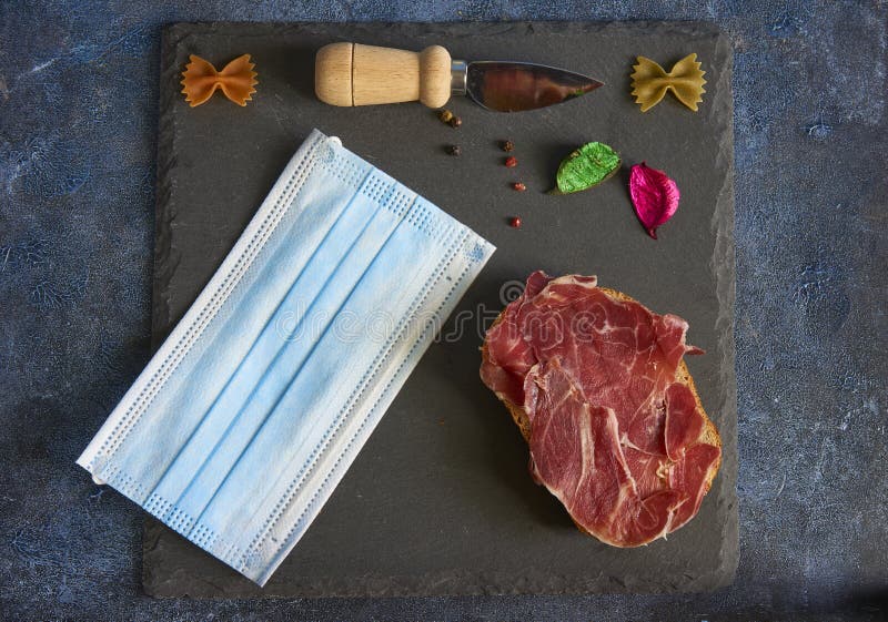 Ham and mask aperitif day stock photo. Image of butcher - 202465672